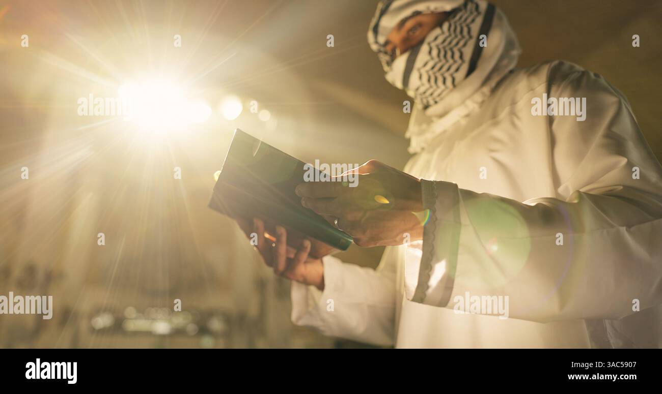Muslim man, Quran or praying in mosque to worship for faith, below or ...