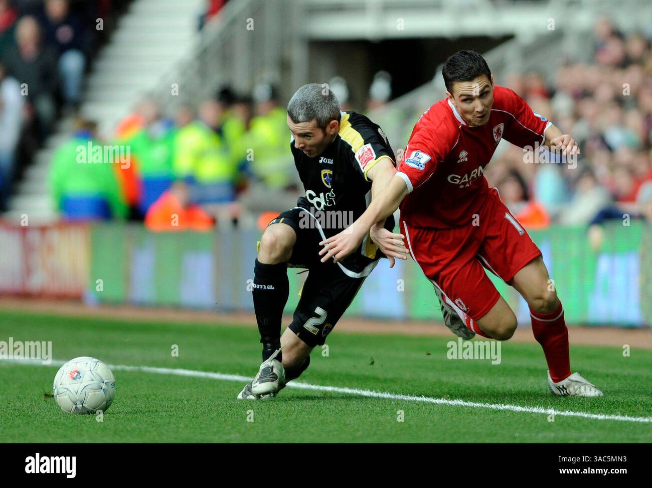 Middlesbrough's Stewart Downing (R) tries to get around Cardiff's Kevin ...
