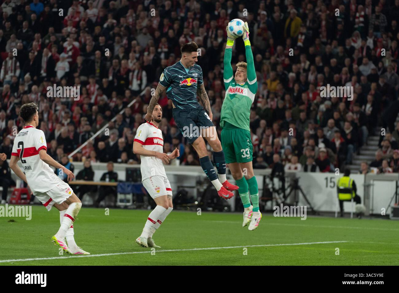 Stuttgart, Deutschland. 02nd Apr, 2025. v.li. Benjamin Sesko (RB Leipzig, #30), Alexander Nuebel ...