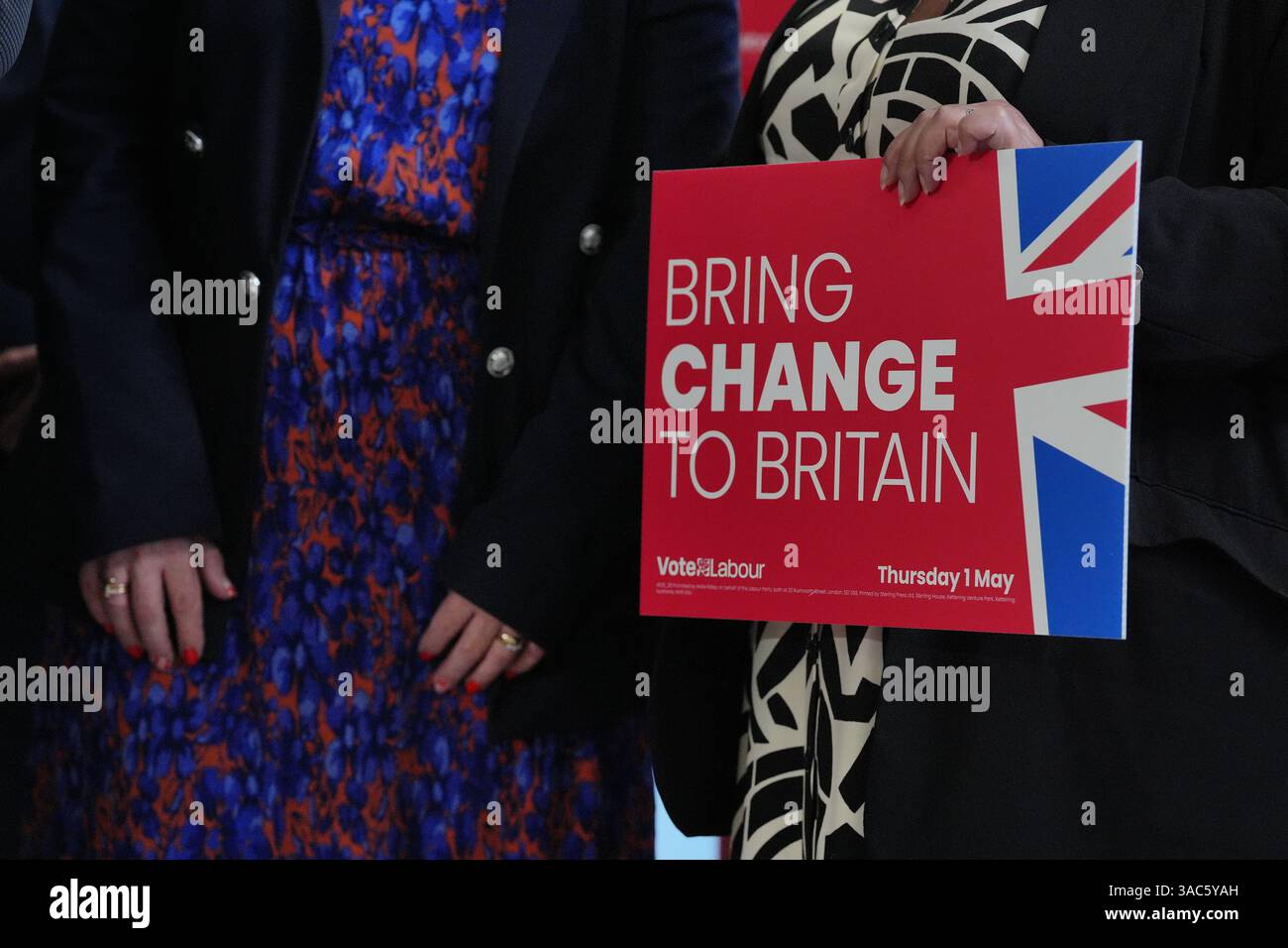 A local activist holds a sign during the launch of the Labour Party ...