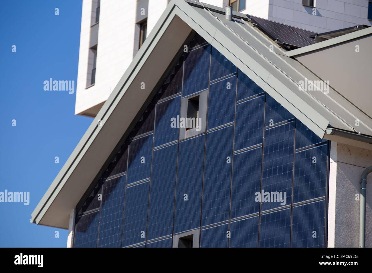 Solar facade: Residential building with solar modules on the facade ...