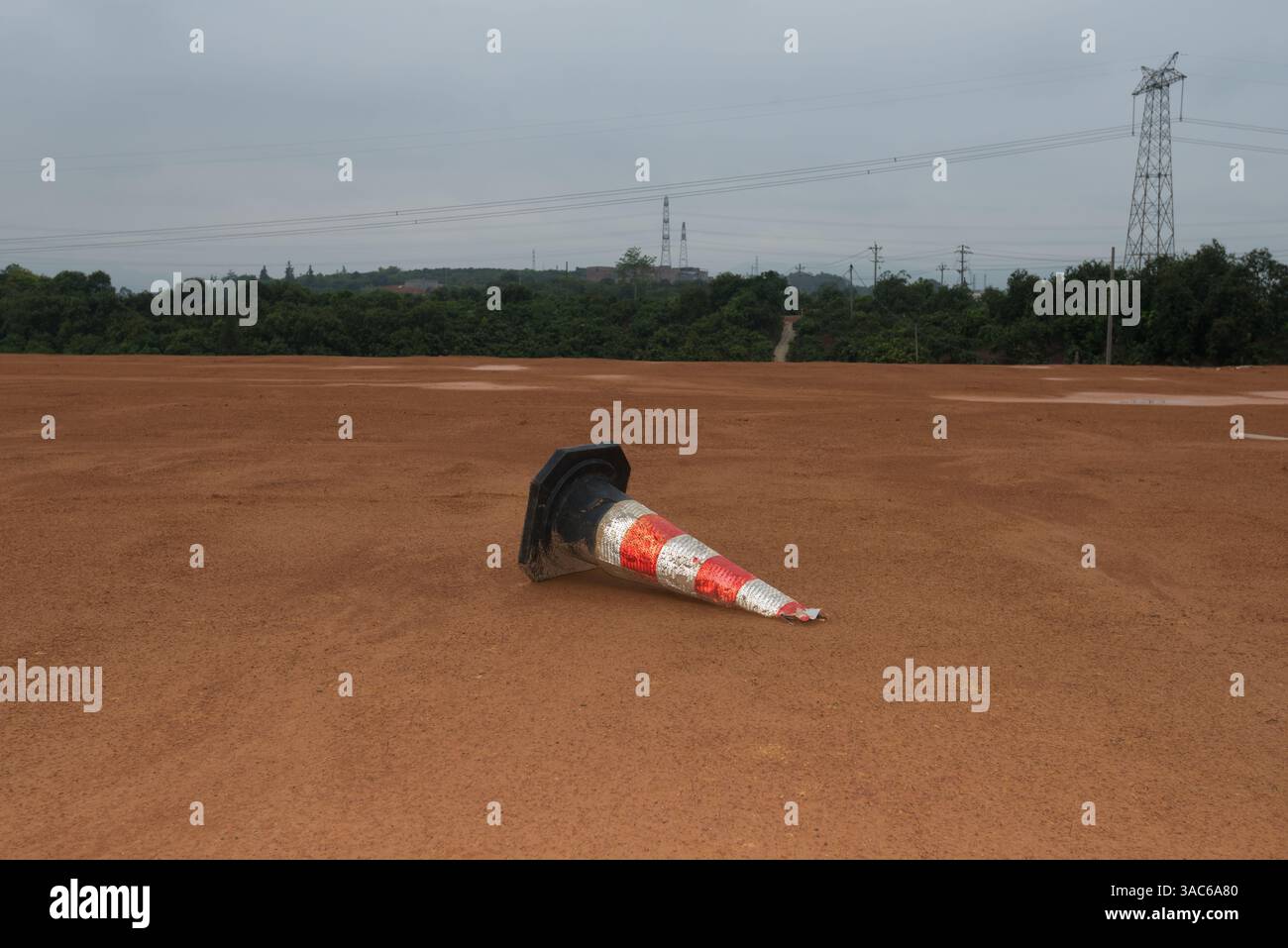 Triangular cone roadblock lying on a gravel surface Stock Photo - Alamy