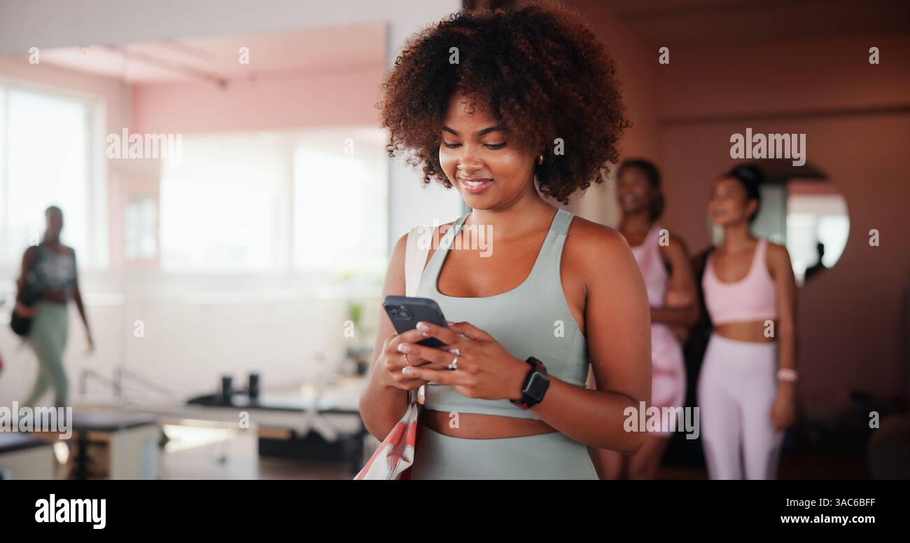 Fitness, happy woman and chat with mobile in gym, health club and ...