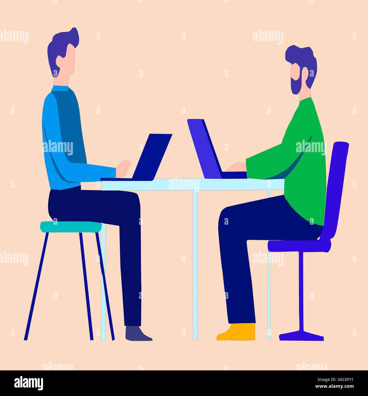 Two men working on a laptop in the office. Colleagues sitting at their ...