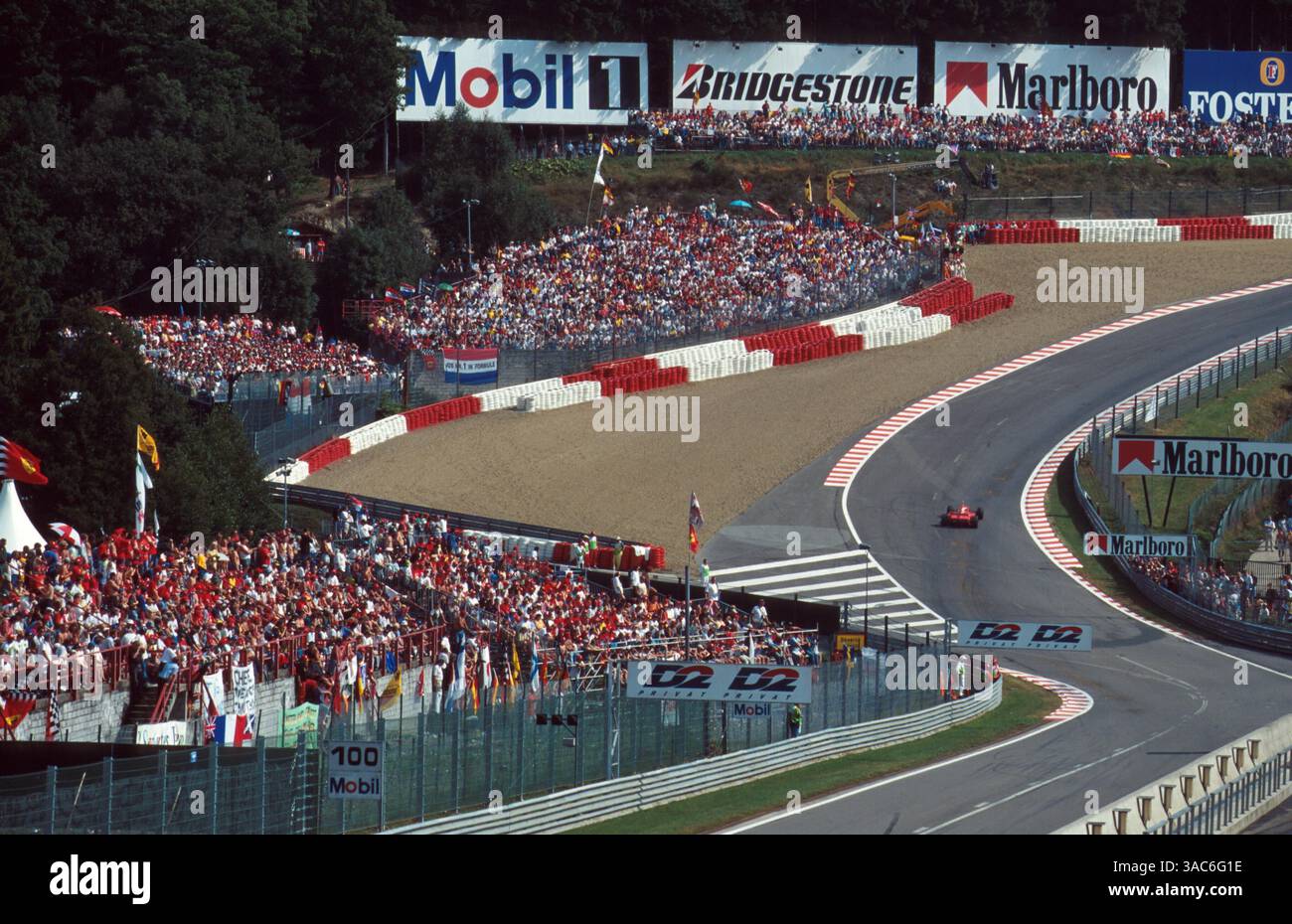 Winner Michael Schumacher (GER) Ferrari F310B takes the famous Eau ...
