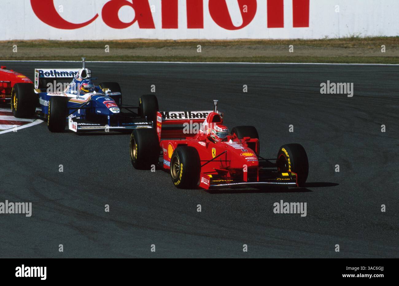Eddie Irvine(GBR) Ferrari F310B leads Villeneuve..Japanese Grand Prix ...