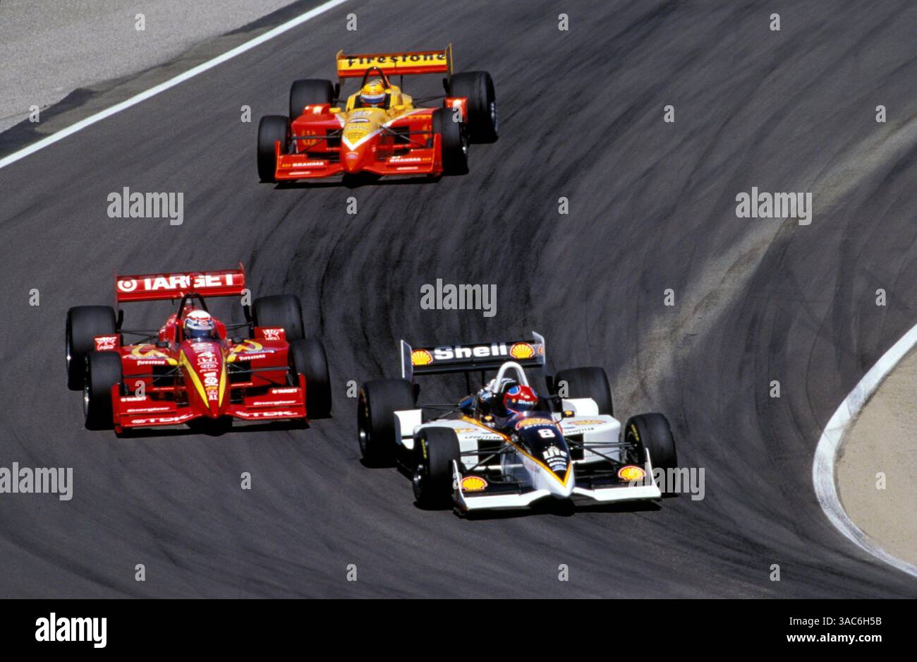 Alex Zanardi (ITA) Reynard Honda 97I, attempts to take a position from ...
