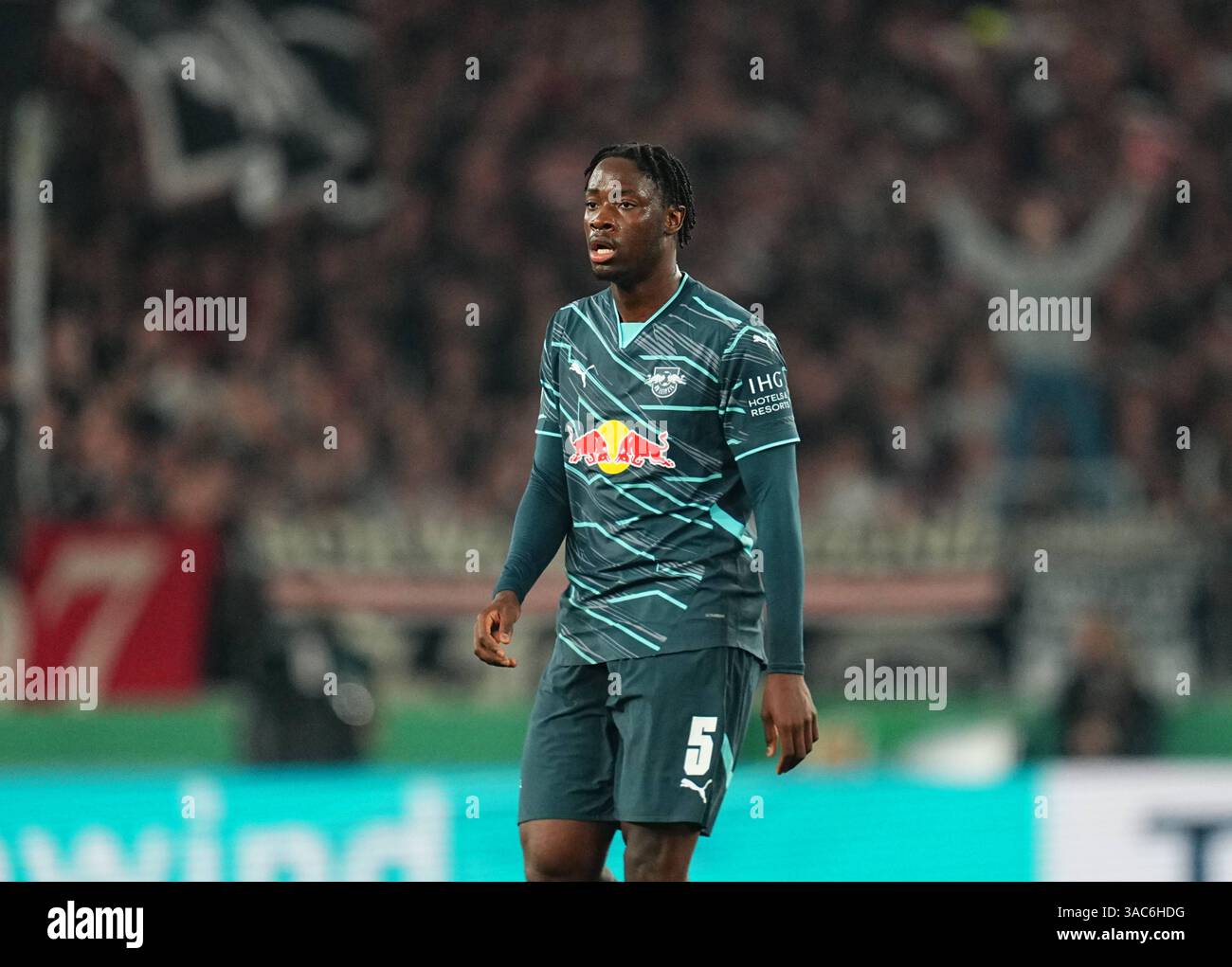 Stuttgart, Germany. 02nd Apr, 2025. April 02 2025: El Chadaille Bitshiabu of RB Leipzig looks on ...