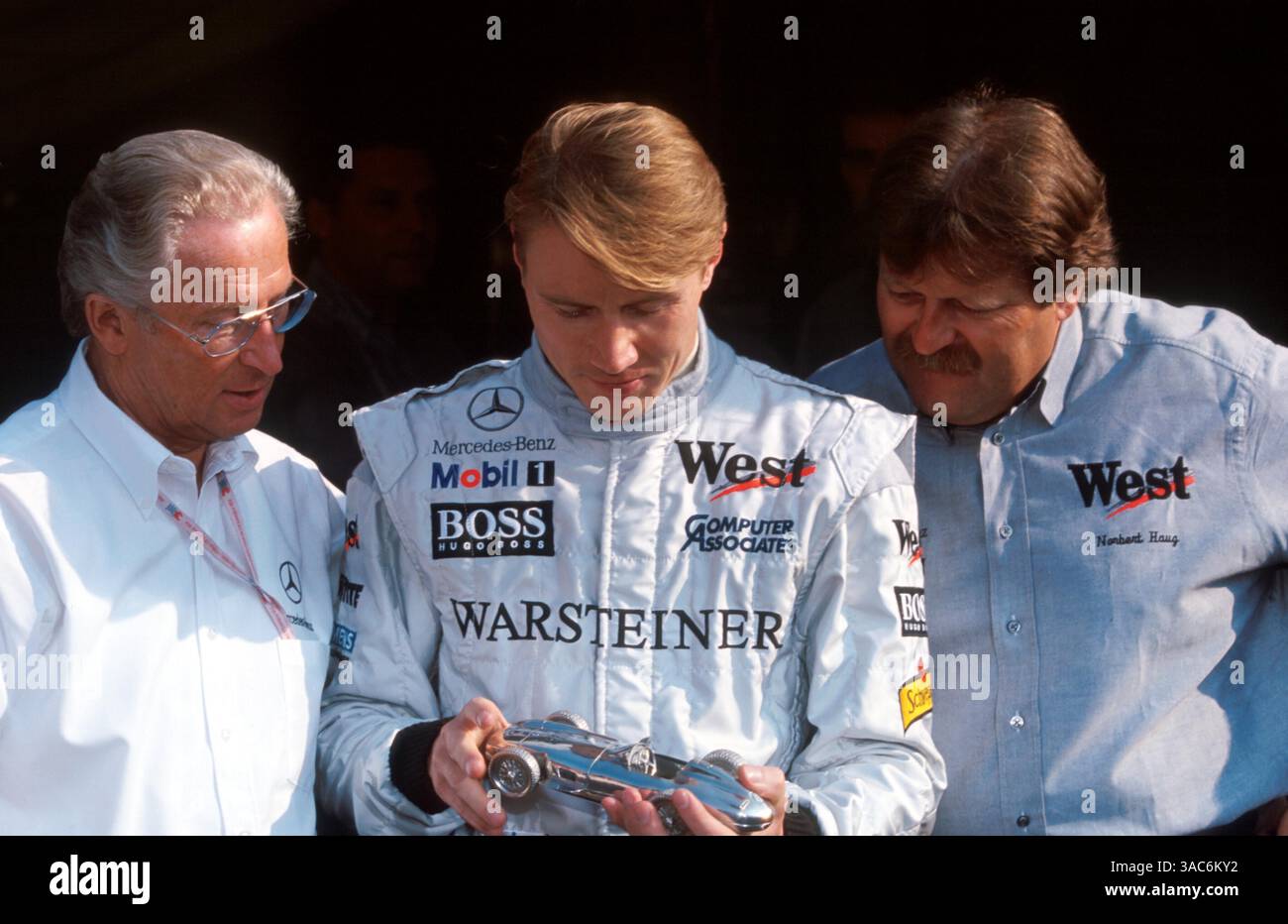 L to R): Jurgen Hubbert (GER) Daimler Chrysler, Mika Hakkinen (FIN ...