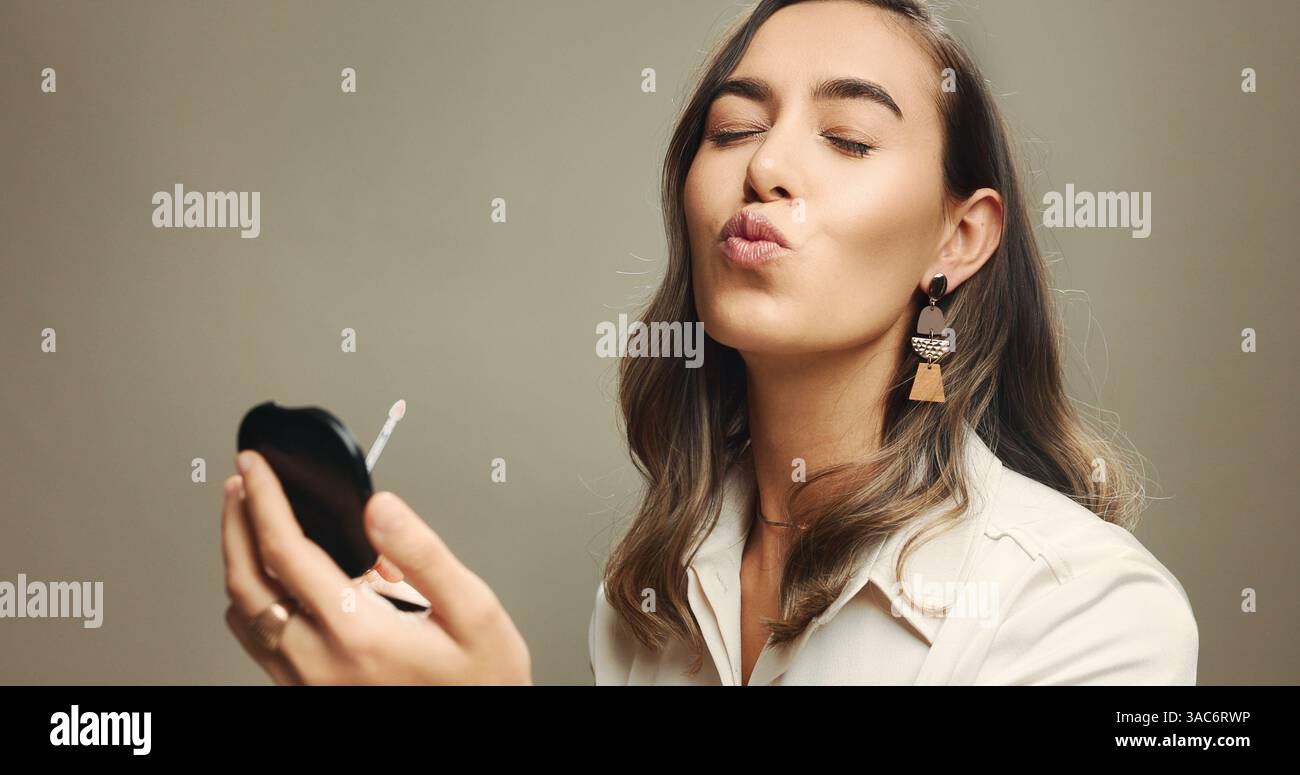 Woman, pout and lipstick in studio with beauty, funny and application ...