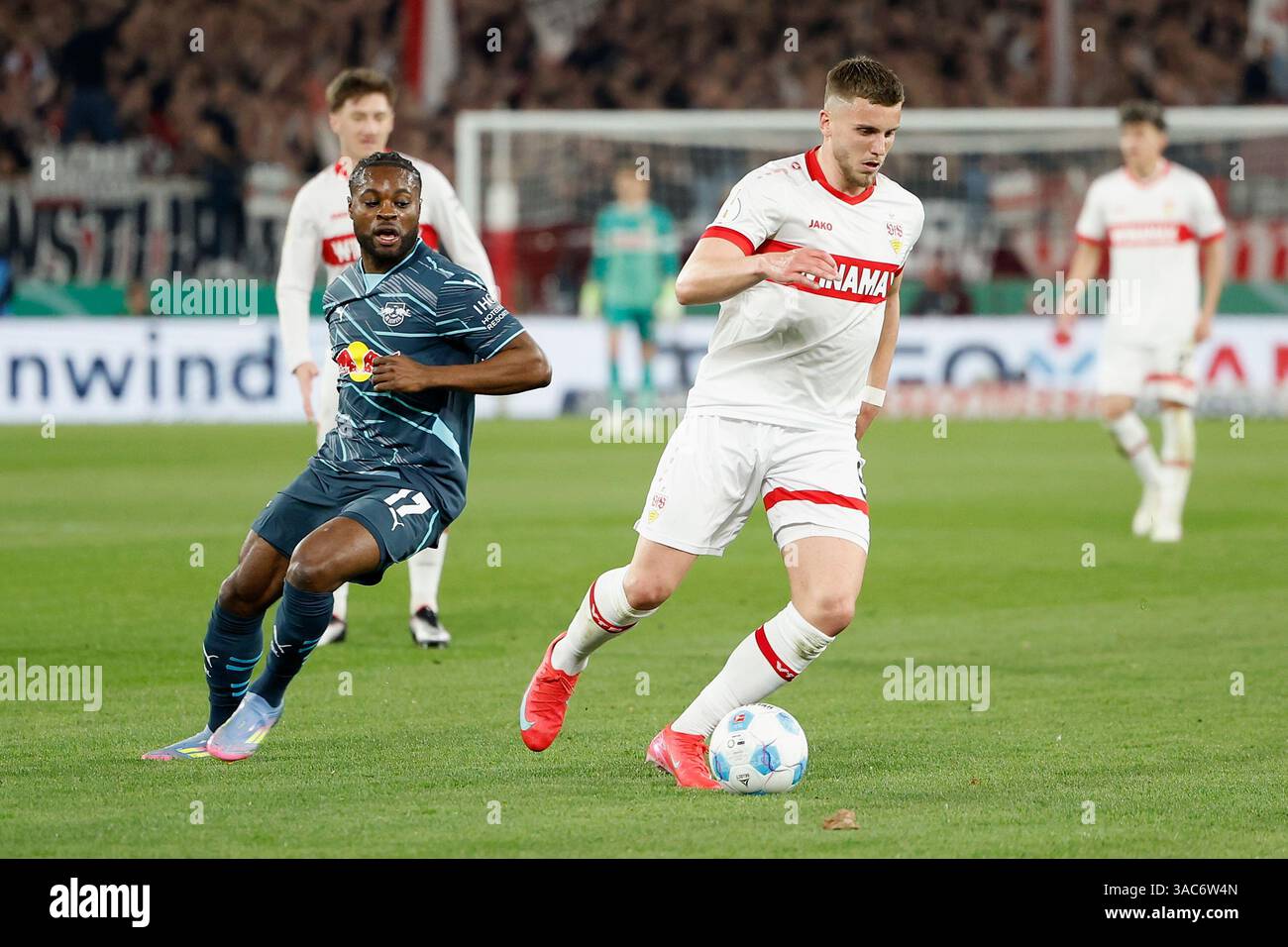 Stuttgart, Ger. 02nd Apr, 2025. Im Bild: v.l. Ridle Baku (RB Leipzig, 17) und Ermedin Demirovic ...