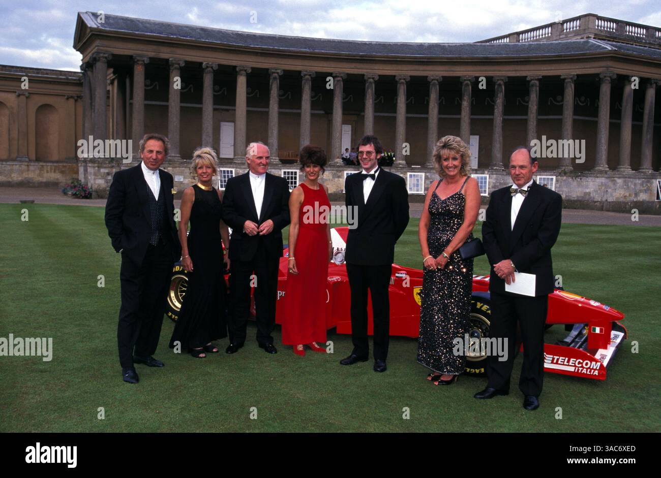 Guests pose in front of a 1997 Ferrari F310B...British Grand Prix Ball ...