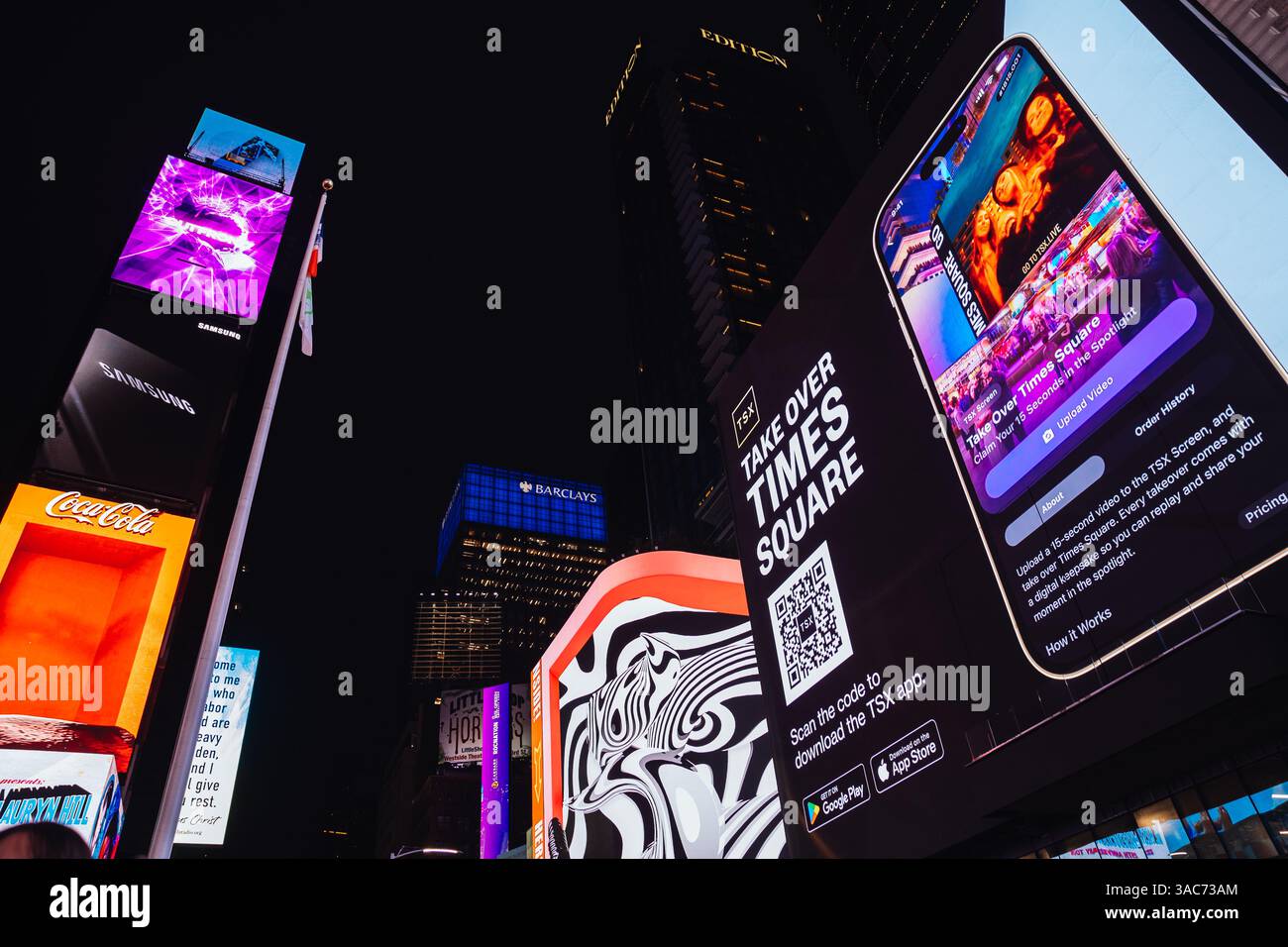 A crowd of people standing, walking, and talking at Times Square at ...