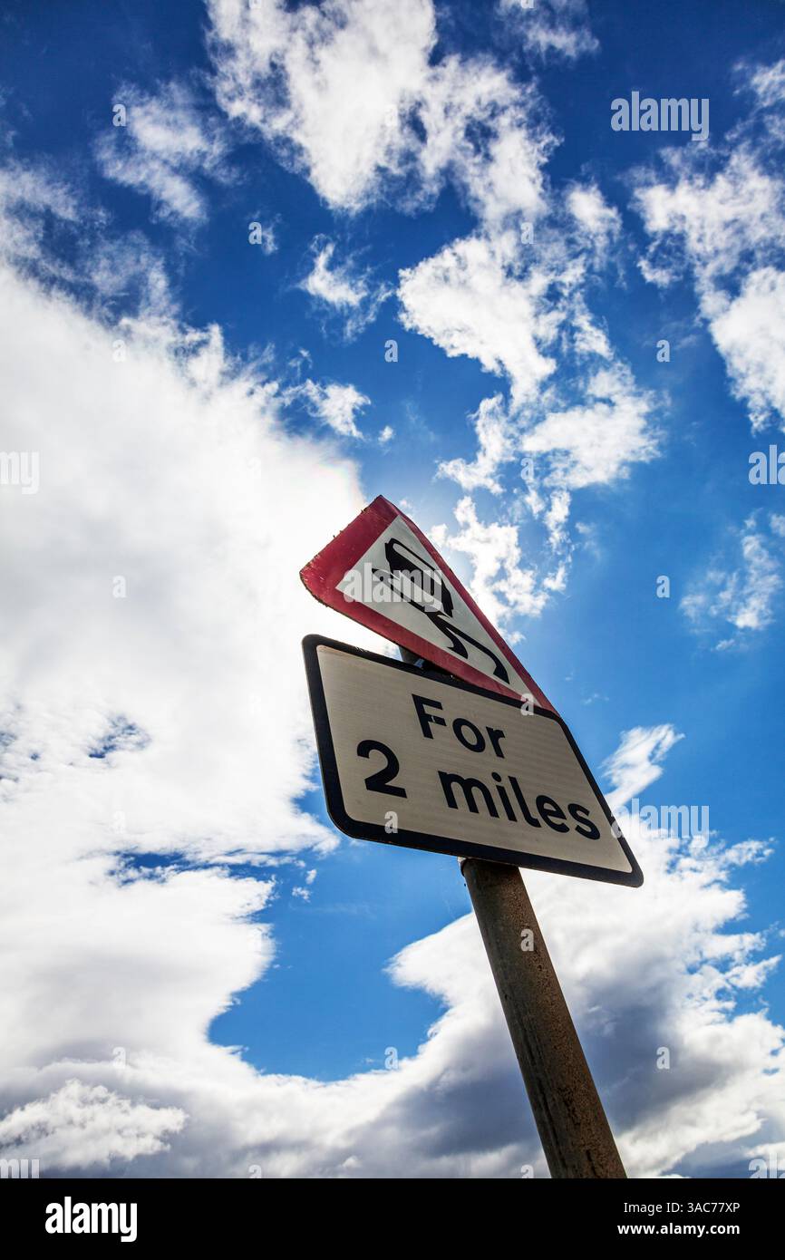 Slippery road, Slippery road UK road sign, for 2 miles, Slippery road ...