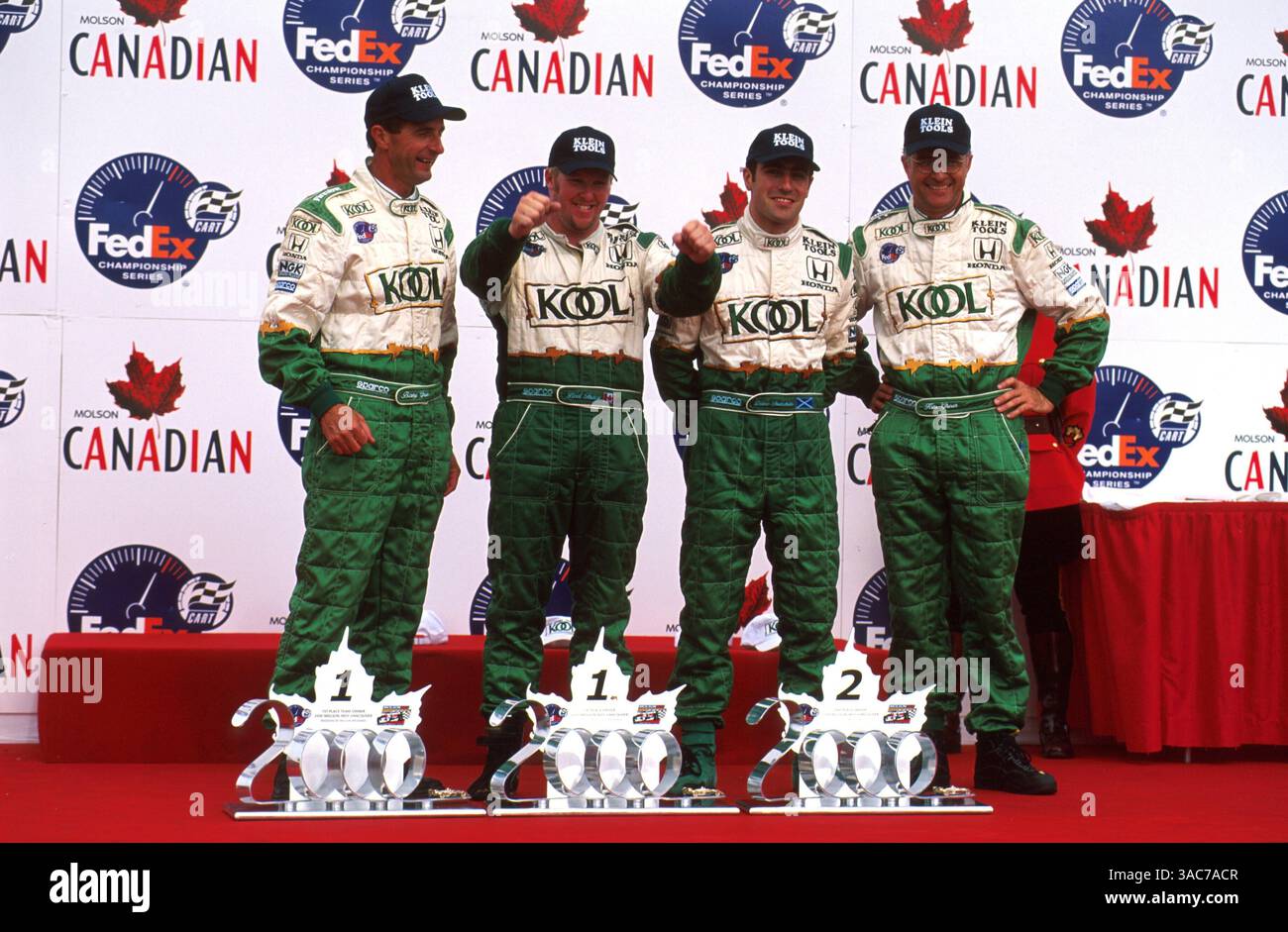 Barry Green, left, and Jim Green, right, celebrate the 1-2 finish with ...