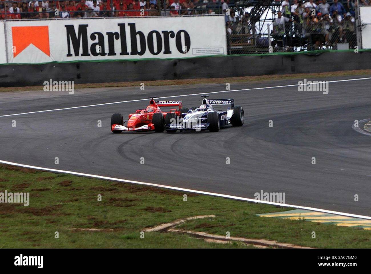 Juan Pablo Montoya(COL) BMW Williams FW23 passes Michael Schumacher(GER ...