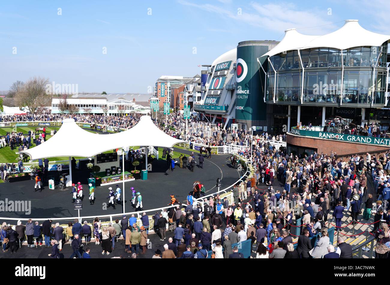Jockeys walk through the parade ring ahead of the Boodles Anniversary 4 ...