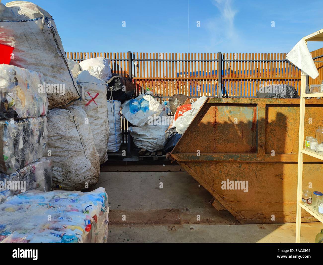 Recycling station with compressed waste materials Stock Photo - Alamy