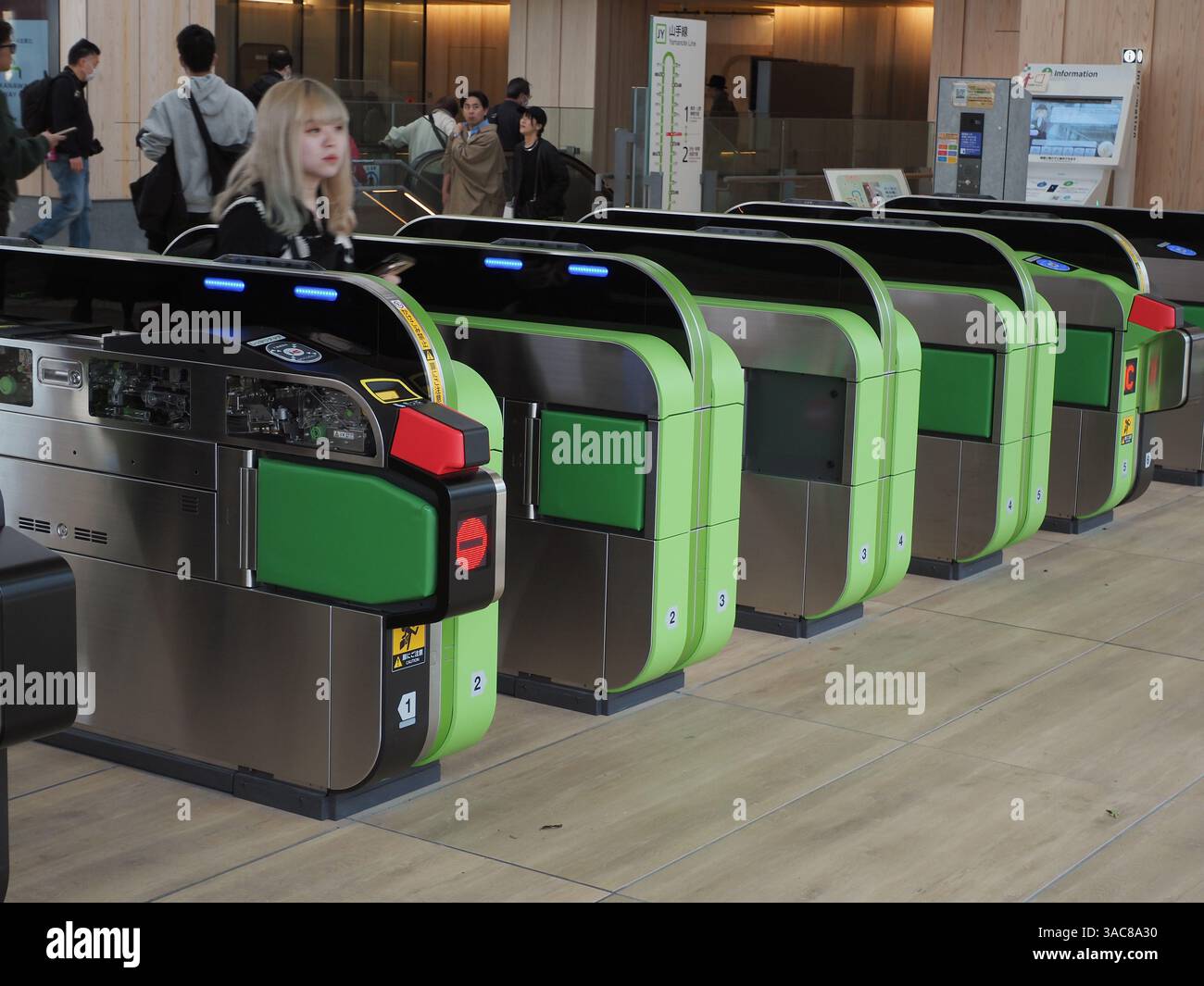 TOKYO, JAPAN - March 30, 2025: Ticket gates at Takanawa Gateway Station ...