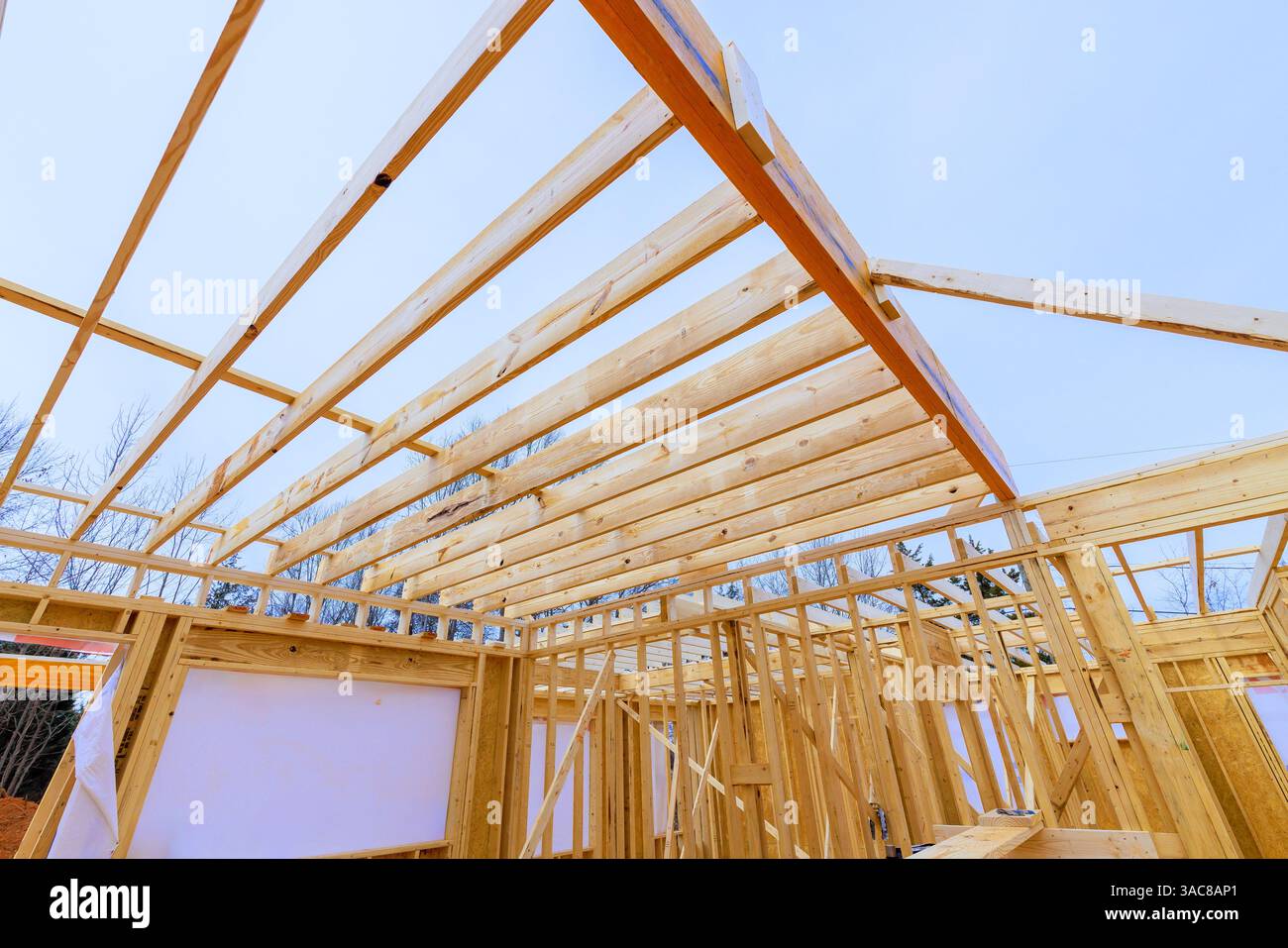 Builders are working on wooden frame structure beams roof timber beams ...