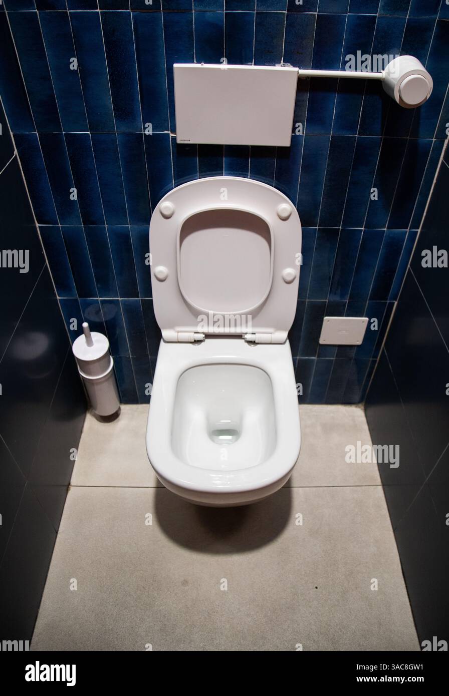 Authentic Italian restaurant restroom featuring toilet elegant decor ...