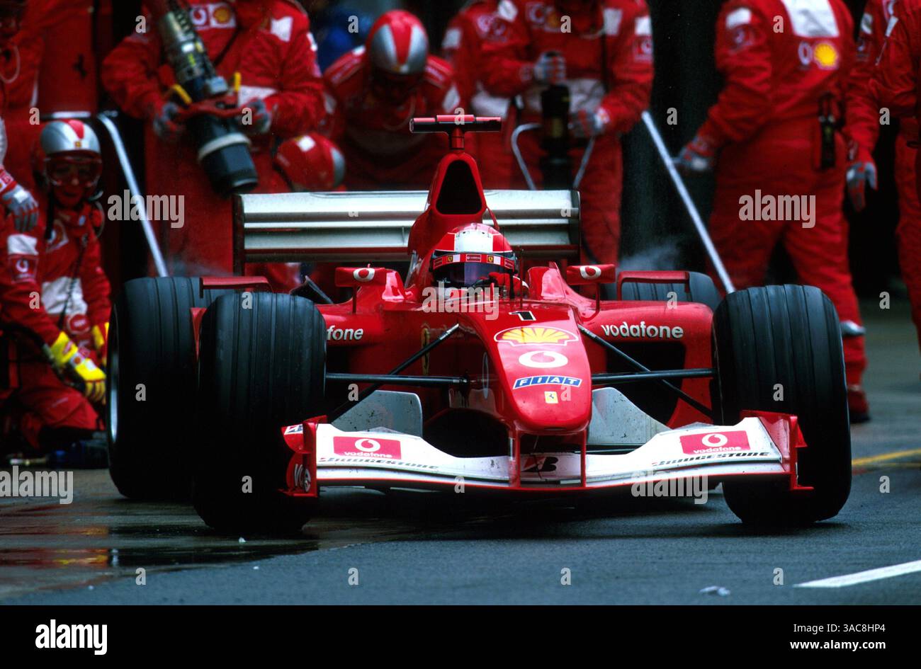 Race winner Michael Schumacher (GER) Ferrari F2002, leaves the pits ...