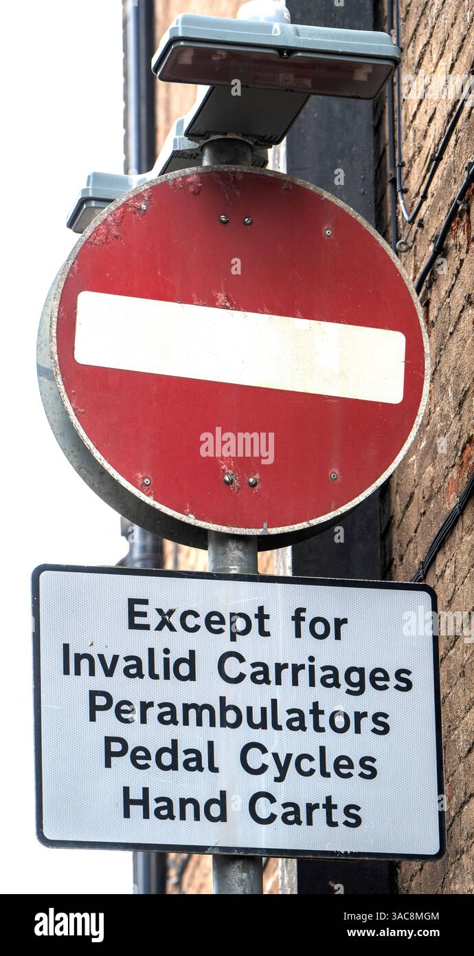 "No Entry" sign with an additional sign below it. The text on the lower ...