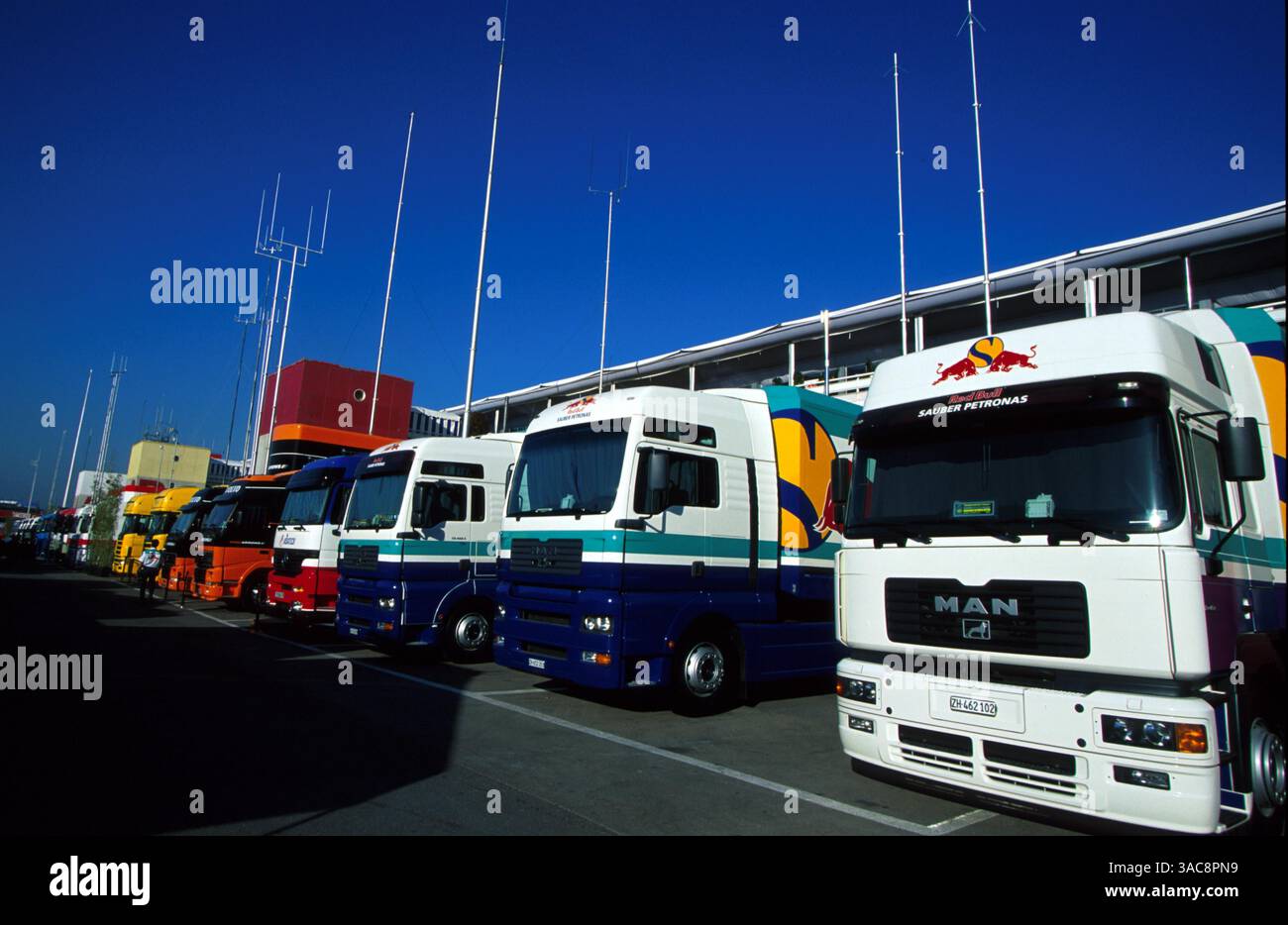 The Sauber Petronas MAN transporters line up with the other F1 teams in ...
