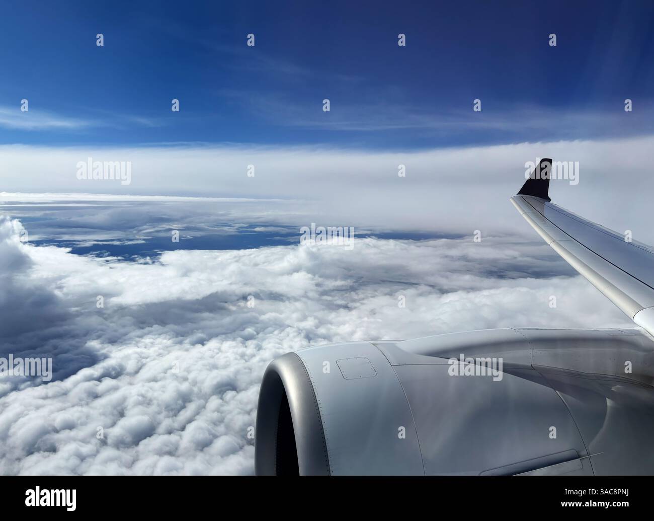 Aerial view of sky and clouds from above seen through the aircraft ...