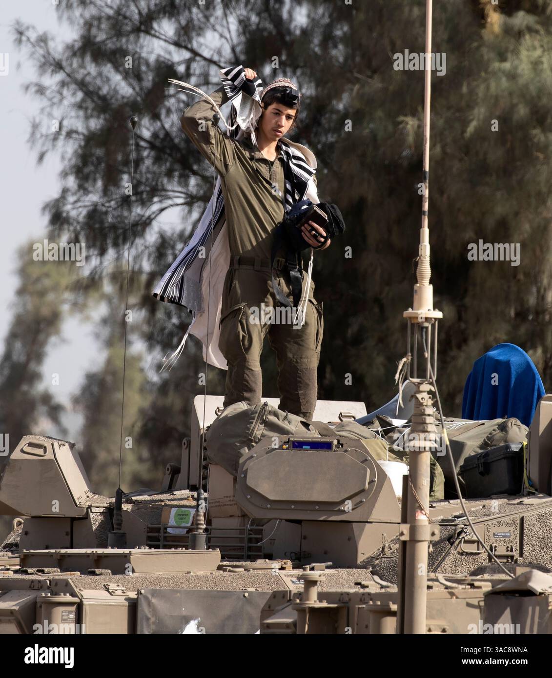 An Israeli solder atop an armored personnel carrier (APC) during ...