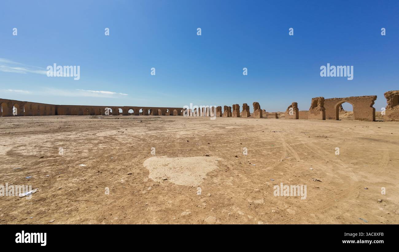 A panoramic view of ancient ruins under a clear blue sky. The landscape ...