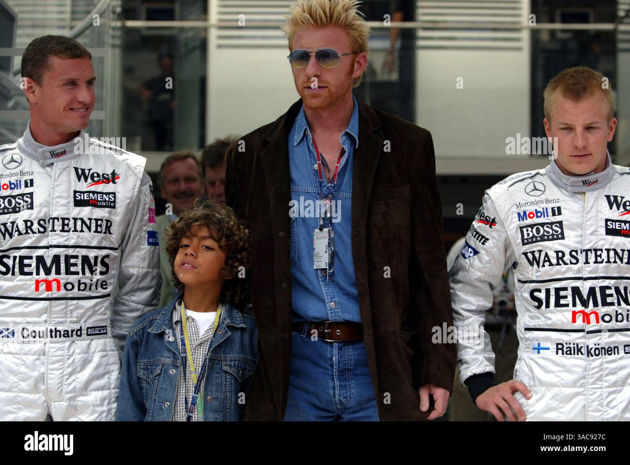 Tennis legend Boris Becker (GER) and son are flanked by David Coulthard ...