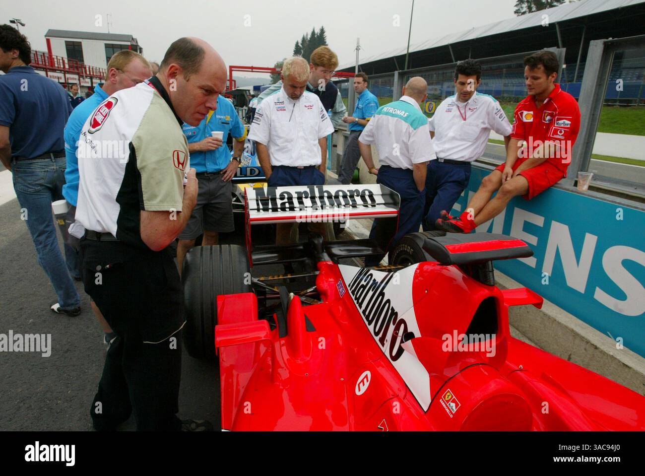 Jock Clear (GBR) BAR Senior race engineer inspects the Ferrari F2002..Belgian Grand Prix, Spa ...