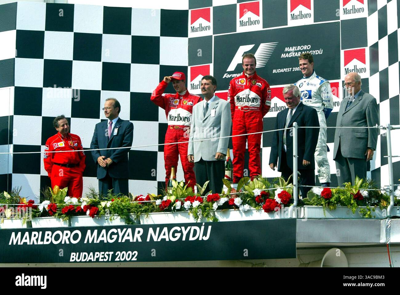 L-R) Jean Todt (FRA), Michael Schumacher (GER), Rubens Barrichello (BRA ...