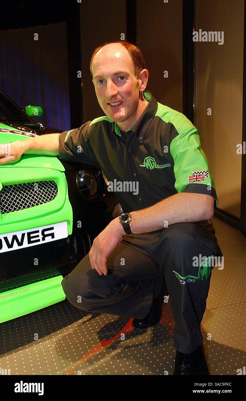 Gwyndaf Evans (GBR) poses with the Super 1600 MG ZR EX258 rally car ...