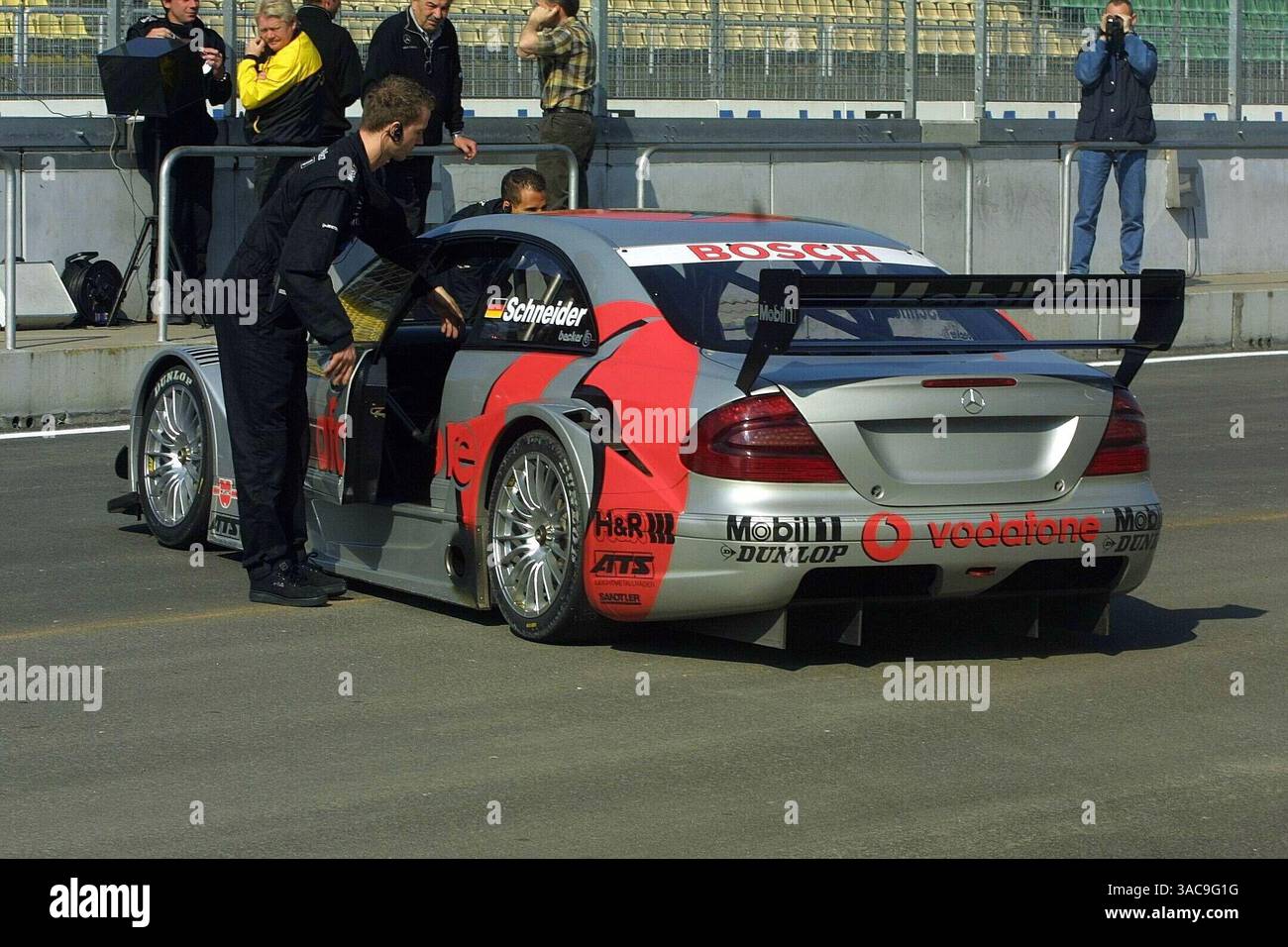 Reigning DTM Champion Bernd Schneider (GER) returns to the pits in the ...