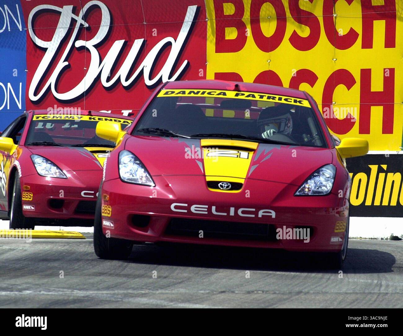 L-R) Danica Patrick (USA) Toyota Celica, leads Tommy Kendall (USA) in a ...