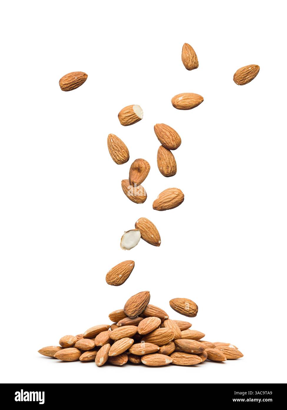 Almonds falling on a pile, isolated on white background Stock Photo - Alamy