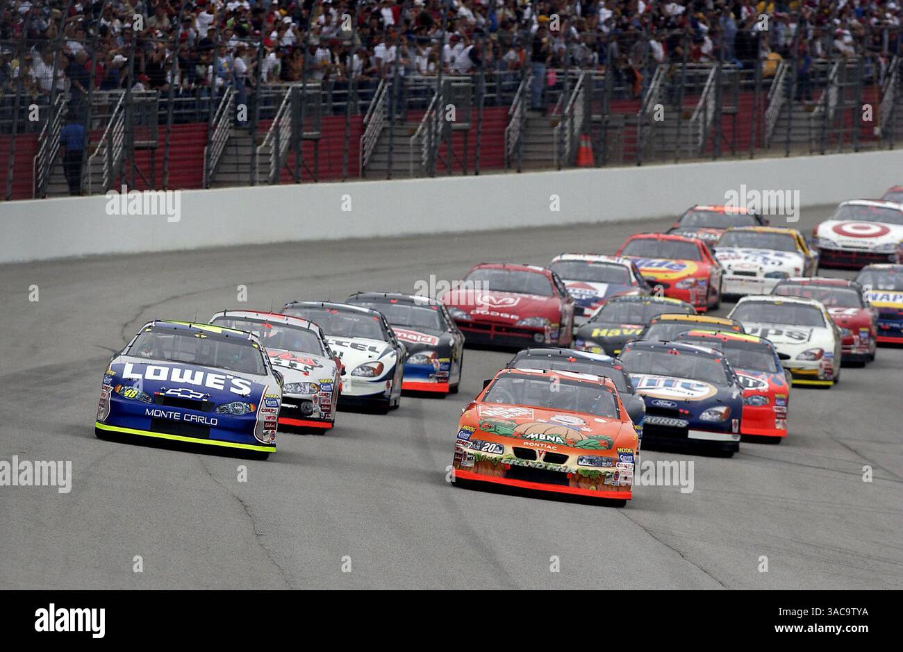 Tony Stewart (USA) and Jimmie Johnson (USA) lead the start..NASCAR ...
