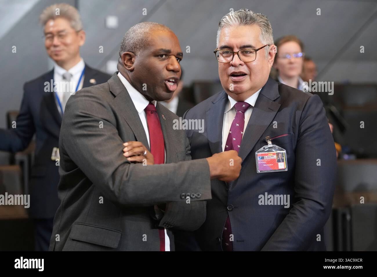 Britain's Foreign Secretary David Lammy, left, speaks with New Zealand ...
