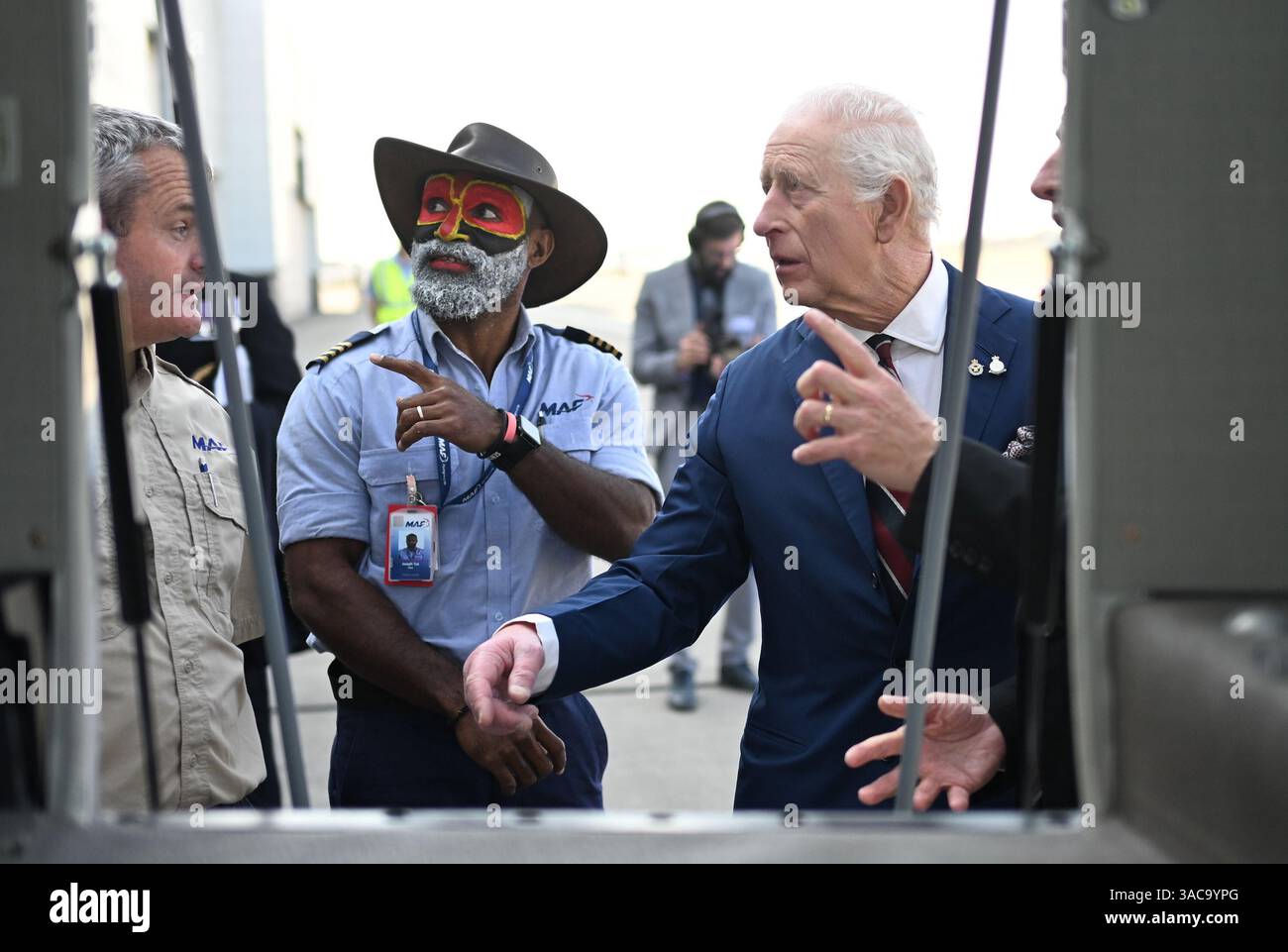 King Charles III inspects the Cessna with Pilot Joseph Tua during a ...