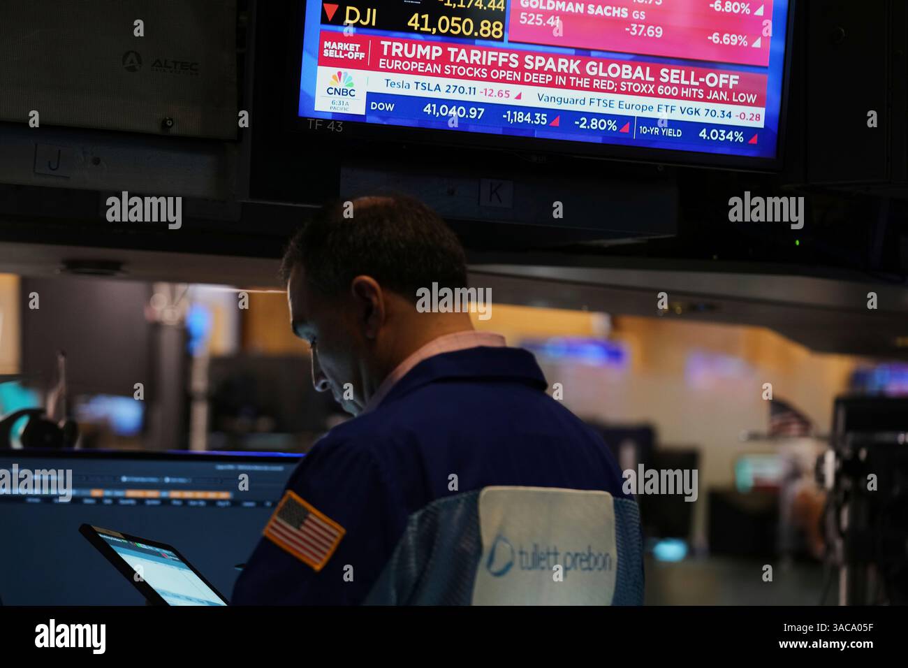 Traders work on the floor at the New York Stock Exchange in New York ...