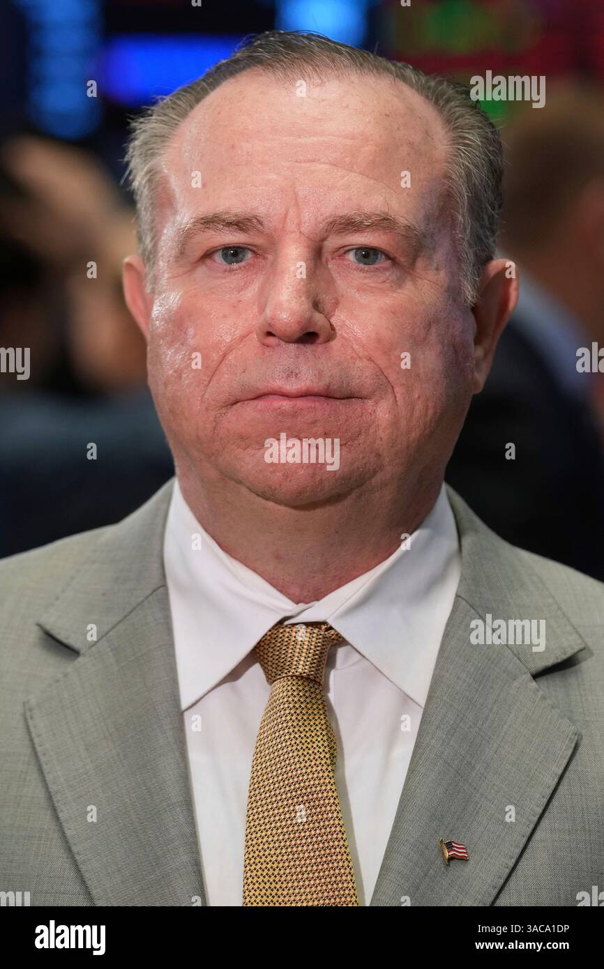 Newsmax CEO Christopher Ruddy poses for a picture on the floor at the ...
