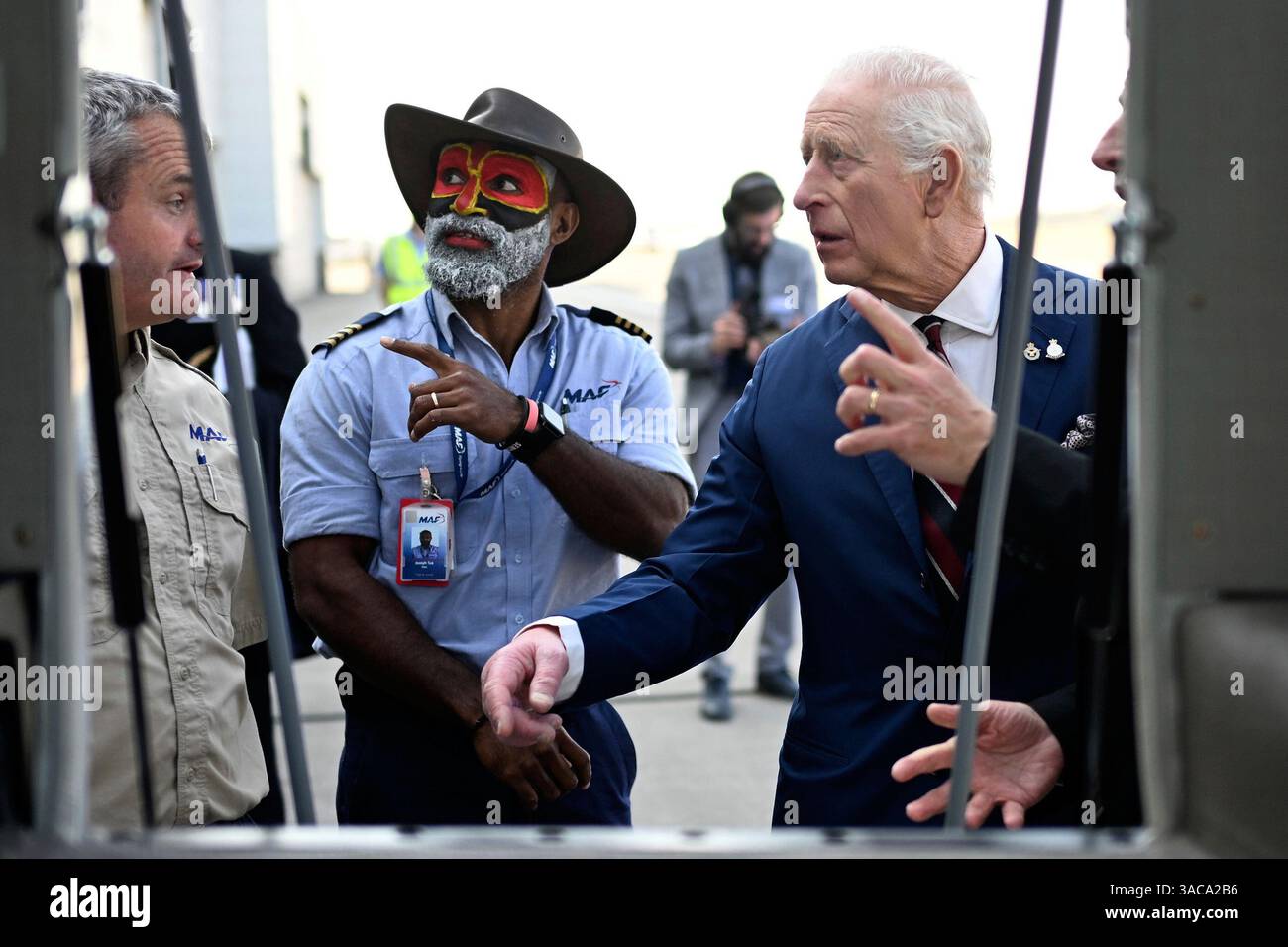 Britain's King Charles III inspects the Cessna with pilot Joseph Tua ...
