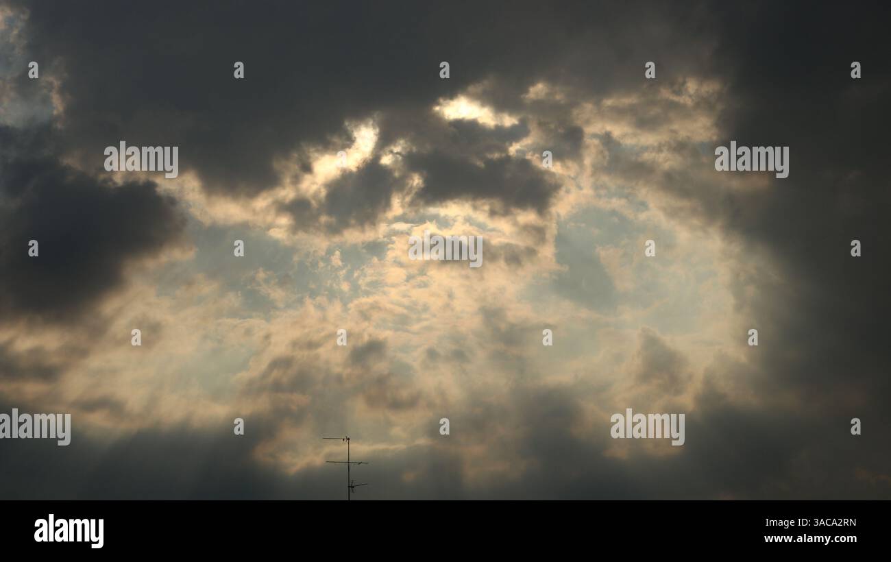 Dramatic Dark Clouds with Sunlight Breaking Through Stock Photo - Alamy