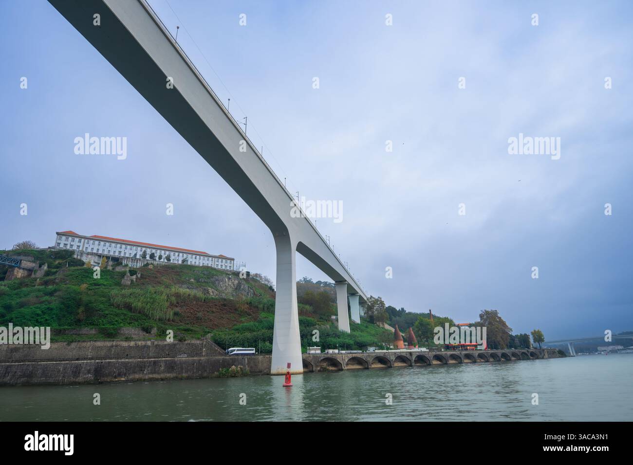 View of Arrabida Bridge, a modern concrete arch bridge in Porto, from a ...