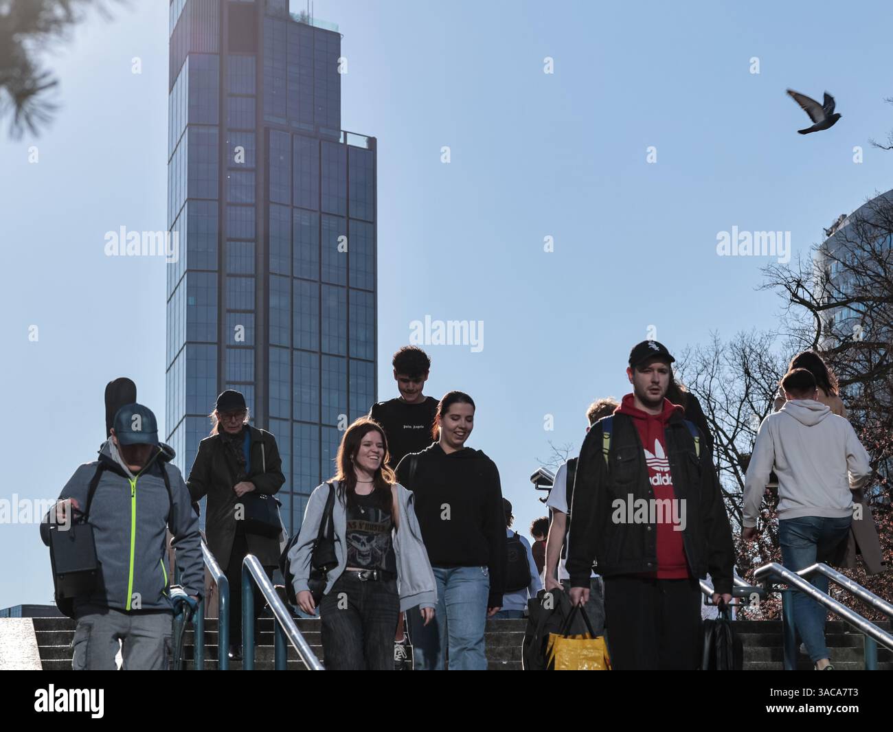 People walk on a high street in central Warsaw, the capital of Poland ...