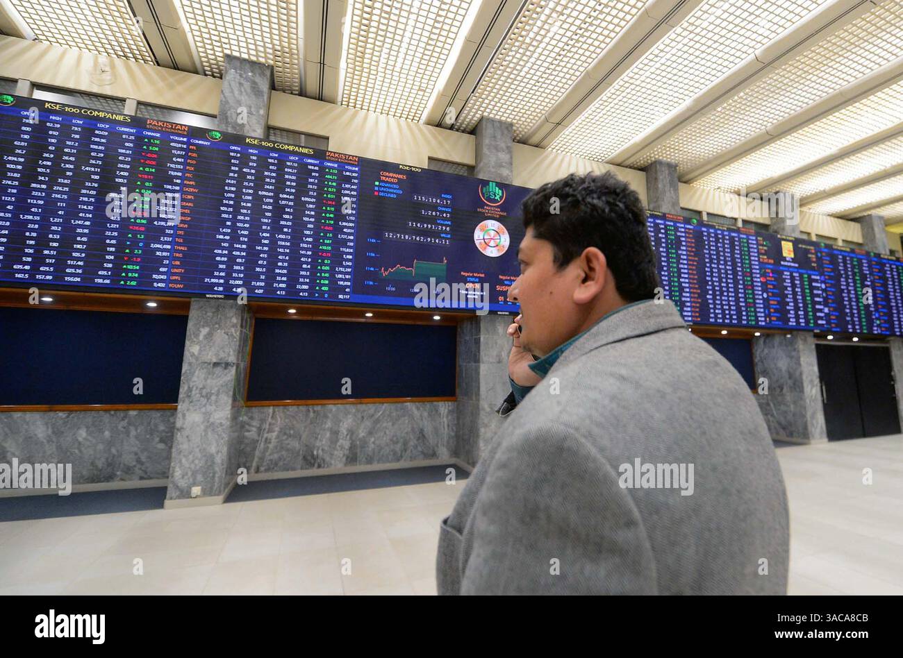 Brokers are busy in trading at Pakistan Stock Exchange (PSX) in Karachi ...