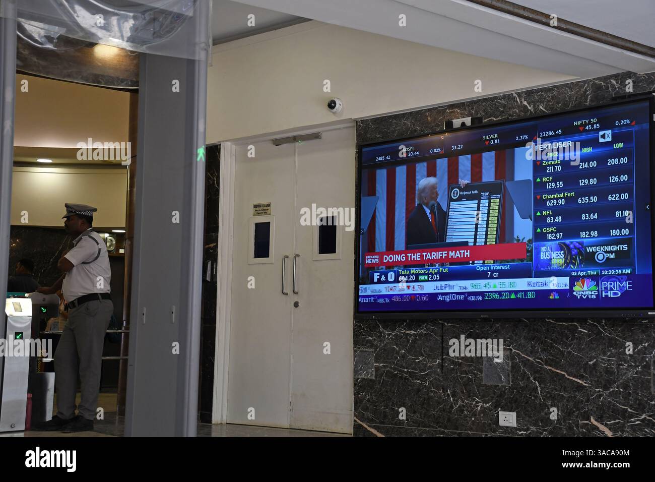 Mumbai, India. 03rd Apr, 2025. LED screen displays tariff news imposed ...
