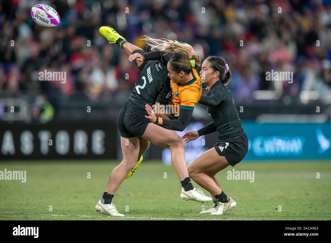 ( L ) Jorja Miller of New Zealand in action with ( C ) Australia player ...